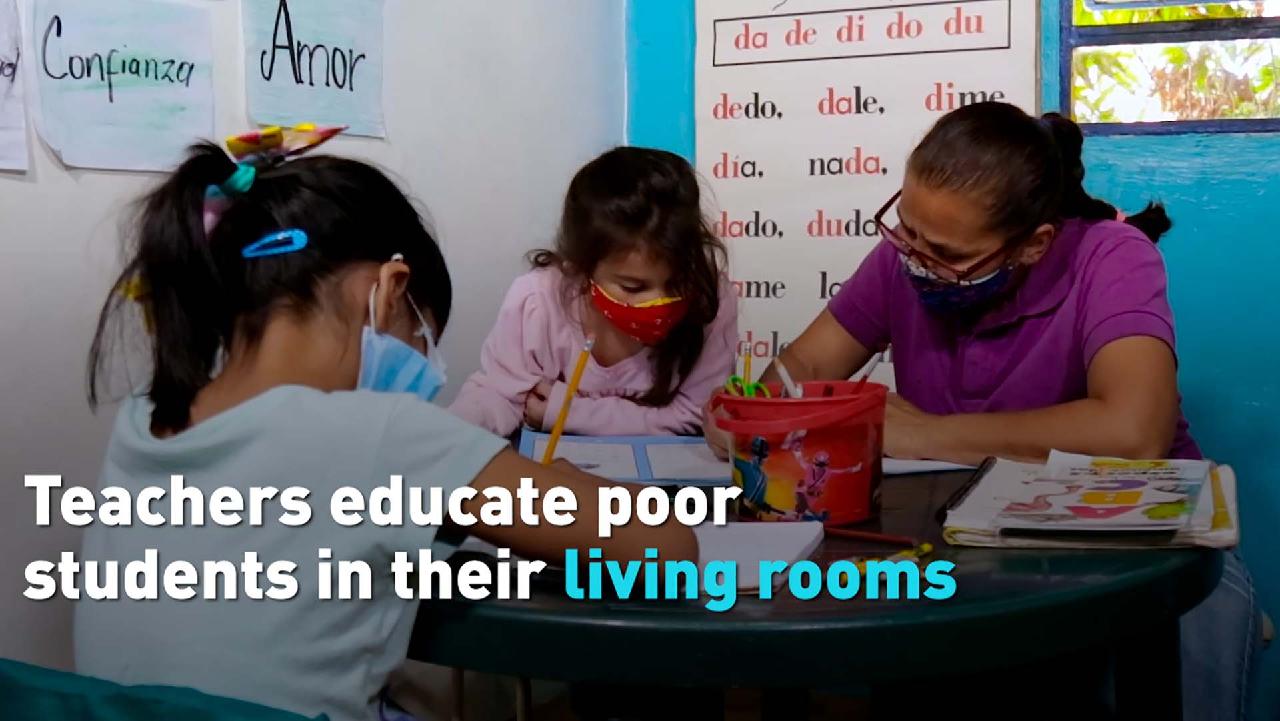 Educators teach in living rooms for children in Venezuela slum - CGTN
