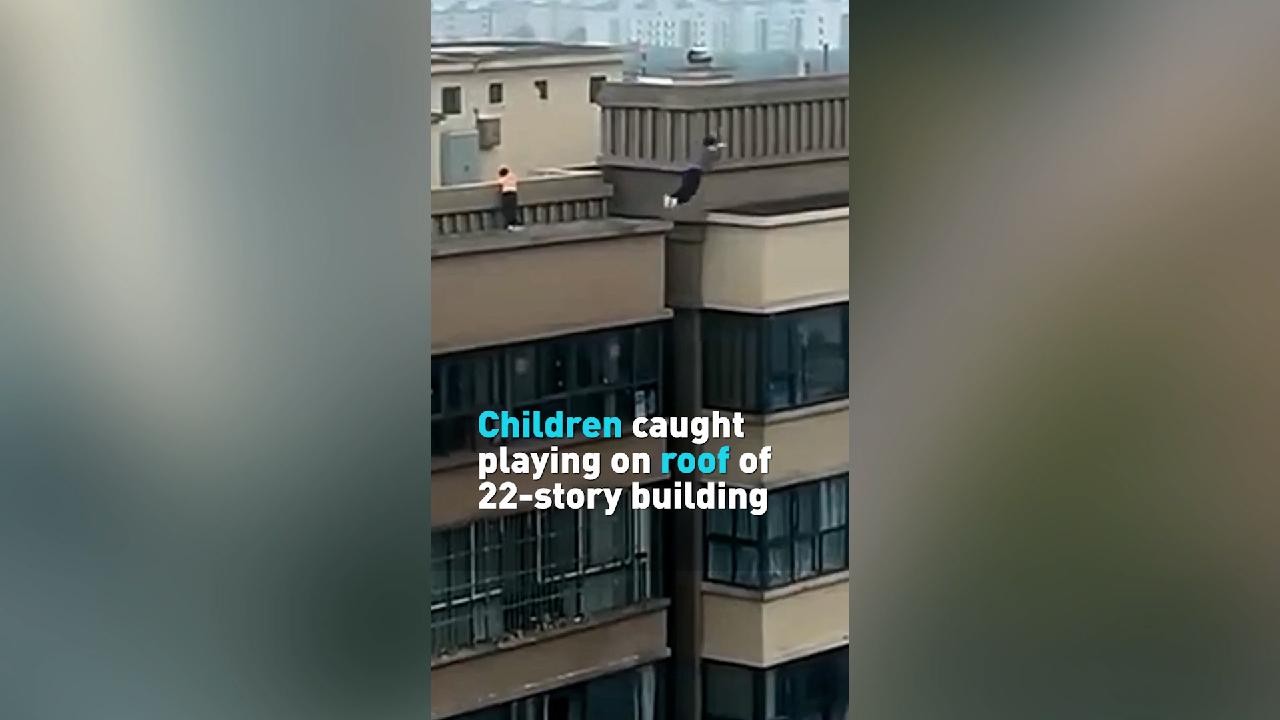 Children caught jumping across roof of tall building - CGTN