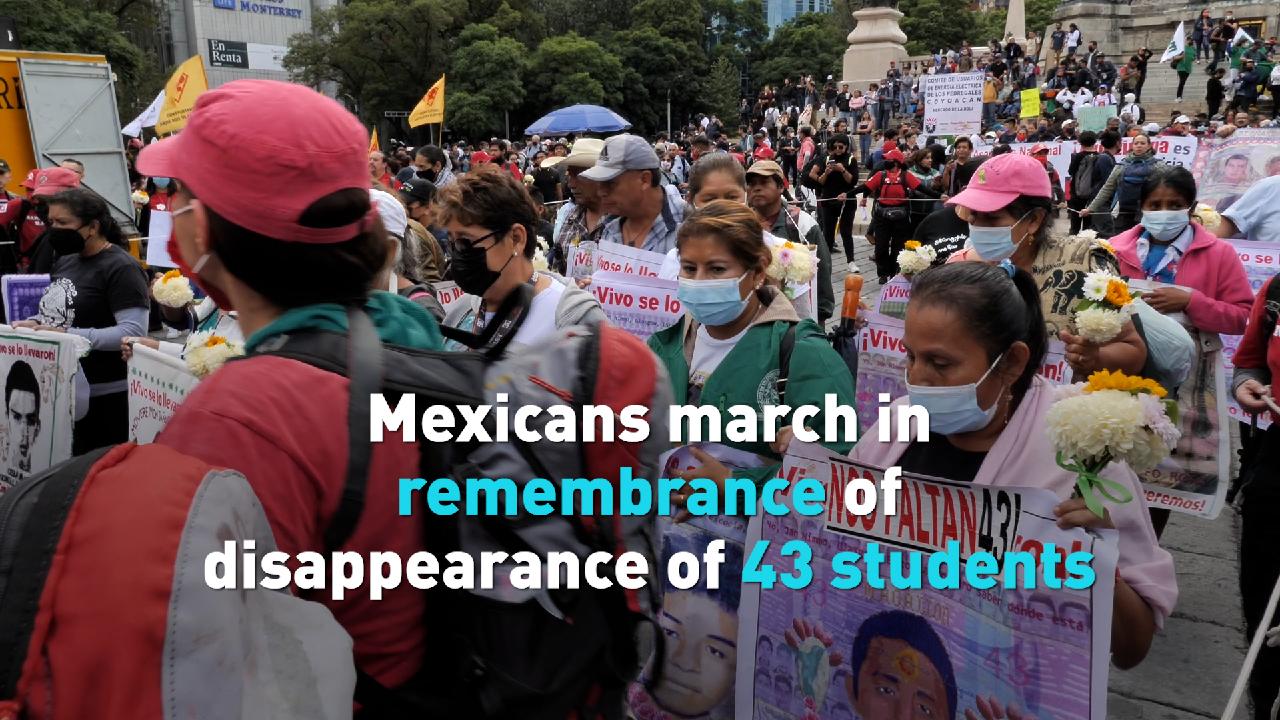 Mexican protesters march on anniversary of 43 missing students - CGTN